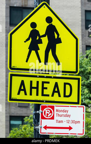 Pedestrians cross the street near Times Square during a winter storm ...