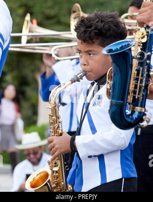 Playing saxophone in a marching band Stock Photo - Alamy