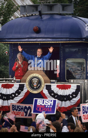 President George H.W. Bush and Barbara Bush wave to the crowd as they ...