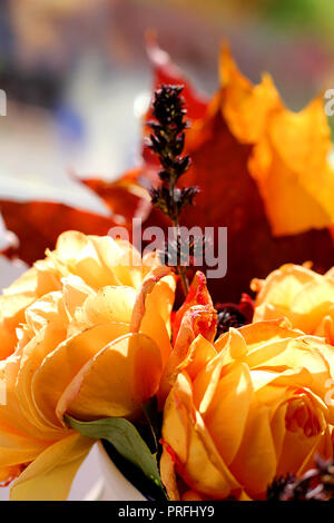 Autumn flower composition with roses and maple leaves Stock Photo - Alamy