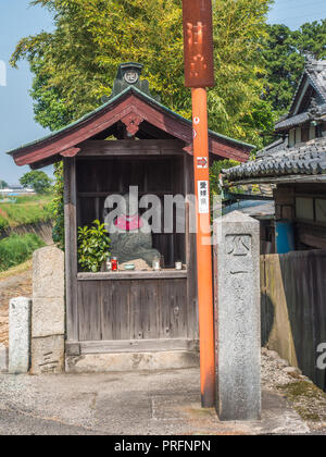 Roadside shrine and finger post guide marker, henro no michi pilgrim ...