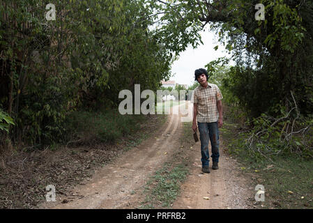 a scary disfigured man, wearing dirty and ragged clothes, with a red ...