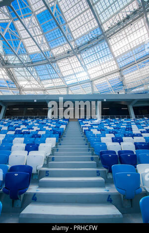 Cement stairs and blue seats inside football stadium Stock Photo - Alamy