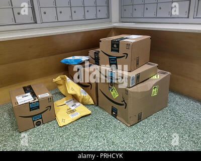 Shipment of Amazon Prime boxes and packages delivered and left in front ...