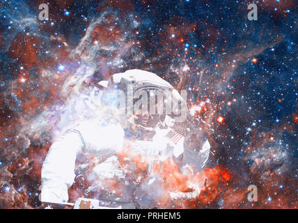 Astronaut in outer space. Nebula and stars on the background Stock ...