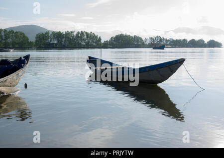small fishing boats refection on the fjord Stock Photo - Alamy