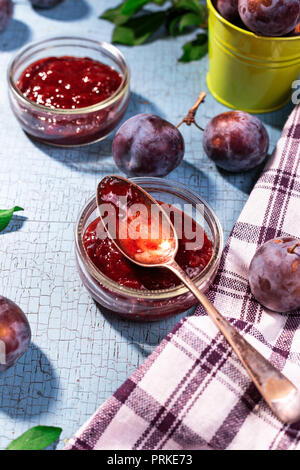 Plums and jam of plum on wood background Stock Photo - Alamy