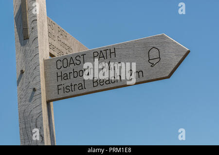Wooden sign pointing to Fistral Beach, Newquay Harbour and route of the ...
