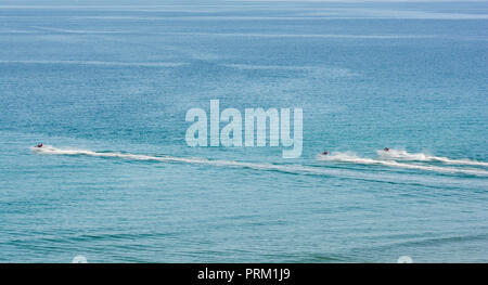 Jet Ski rides and hires at Newquay, Cornwall, the Jet Skis seen in blue ...