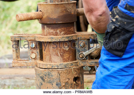 A cable percussion borehole drilling rig set up, ready to work Stock ...
