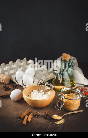 Ingredients for cooking pirok or cookies - flour in a wooden bowl, eggs ...