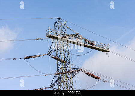 A temporary work platform attached to an electricity pylon for workers ...