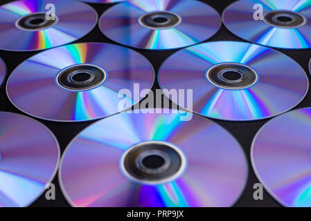 CDs / DVDs lying on a black background with reflections of light Stock ...