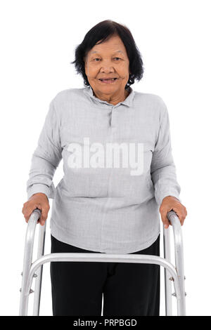 Mature woman with a walker isolated on white background Stock Photo - Alamy