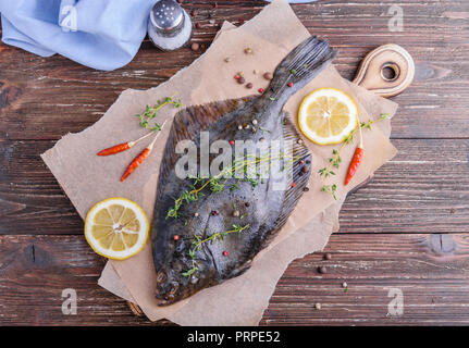 Flounder fish with spices Stock Photo - Alamy