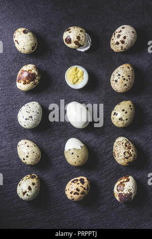 Cooked and fresh raw Quail eggs close up Stock Photo - Alamy