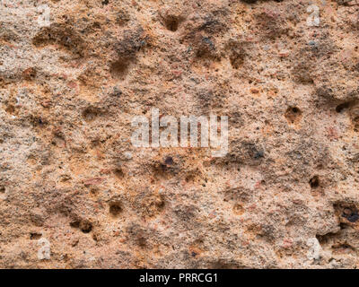Ageing spongy sandstone wall showing signs of crumbling Stock Photo - Alamy