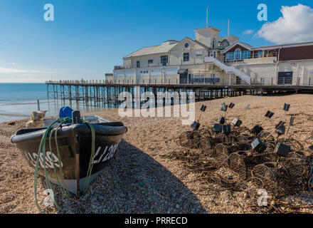 Bognor regis beach with traditional open lobster and crab fishing boat ...