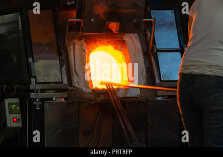 Manufacturing glass in a traditional oven, in glass factory in Murano ...