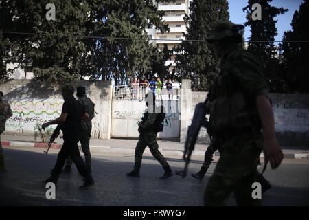 Masked members of the Al-Quds Brigades, the military wing of the ...