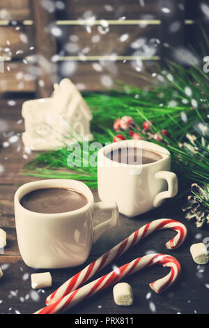 photo of two cups of coffee on a saucer standing on a table covered ...