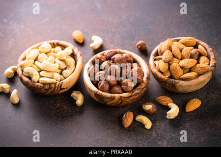 Assortment of nuts in bowls Stock Photo - Alamy