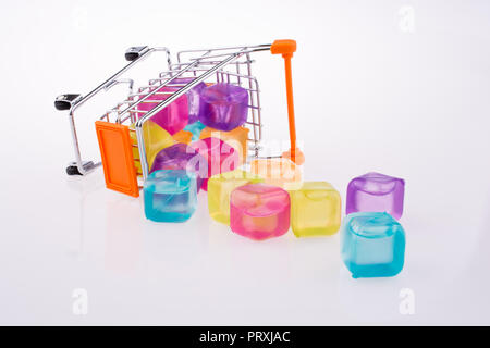Colorful blocks come out of a tumbled shopping cart Stock Photo - Alamy