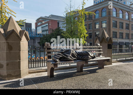Homeless Jesus sculpture bronze on a bench outside Christ Church ...