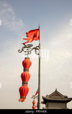 Banner-flag pole on Xian city wall with red lanterns and red flags ...