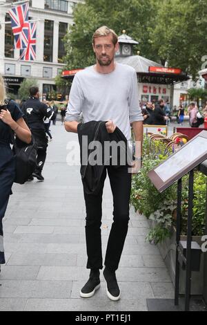 Peter Crouch seen leaving Global studios after covering Radio X for ...