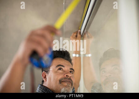 man measuring window Stock Photo - Alamy