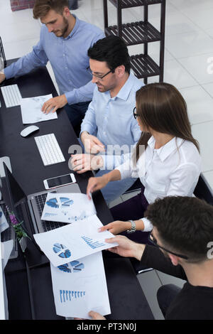 business team discussing marketing schemes in the workplace on the ...