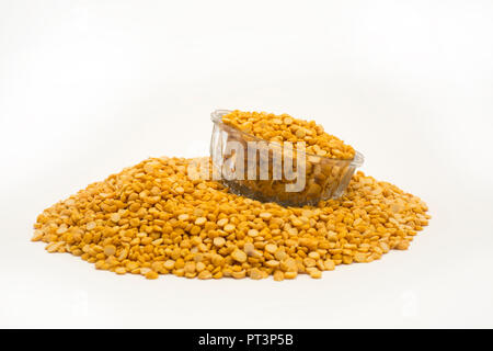 Yellow split peas boot chana dal with bowl isolated on white background ...