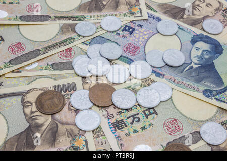 Closeup of Japanese yen banknotes and Japanese yen coin concept ...