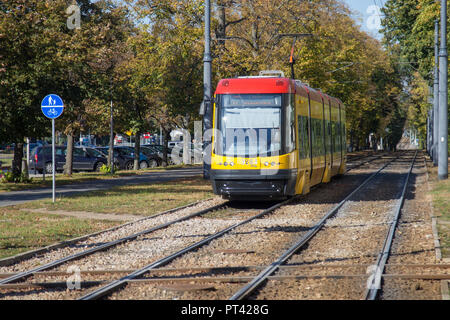 Yellow Pesa Swing 120Na tram in Warsaw, Poland Stock Photo - Alamy
