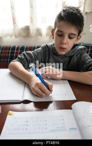 Child do his homework on mathematic Stock Photo - Alamy