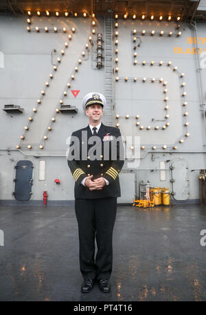 Captain Nicholas J. Dienna, Commanding Officer of the US Nimitz-class ...