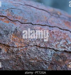 Thick rust encrustation on very heavy duty mooring chain. Rust is a ...
