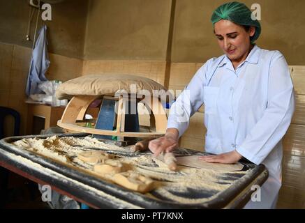 Syrian Women making Bread Stock Photo - Alamy