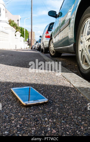 Mobile phone dropped and lost in the grass in the uk countryside Stock ...
