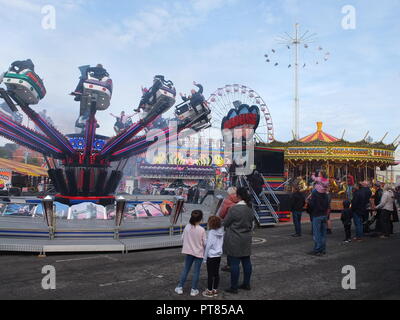 General perspective of Nottingham Goose Fair showing rides including a ...