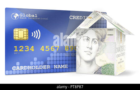 Money bills folded like houses standing next to a credit card ...