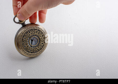 Retro style pocket watch in the hand Stock Photo - Alamy