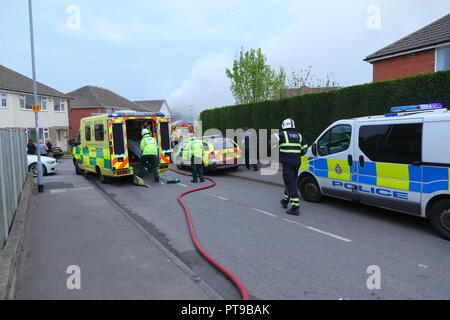 Emergency service vehicles at the scene of a fatal house fire in ...