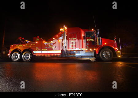 A Kenworth recovery truck arrives to the scene of an accident , where a ...
