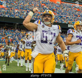 LSU runs onto the field before an NCAA college football game against ...