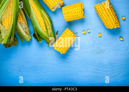 Ripe corn on a blue table close-up. Yellow ripe corn, top view Stock ...