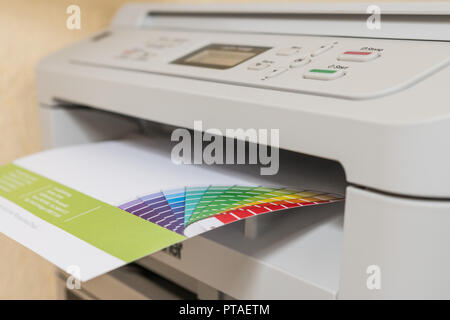Printed sheet of paper comes out of printer Stock Photo - Alamy