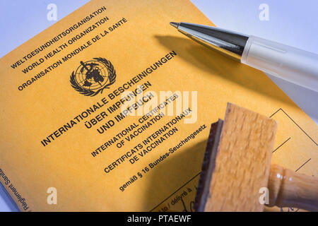 Vaccination certificate with stamp and ballpoint pen Stock Photo - Alamy