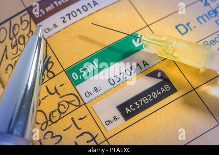 Vaccination certificate with stamp and ballpoint pen Stock Photo - Alamy